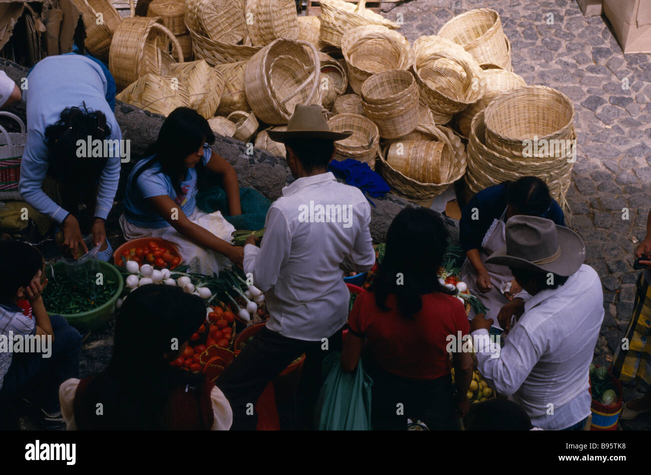 MEXICO Taxco Looking down on customers at fruit and vegetable stall in ...