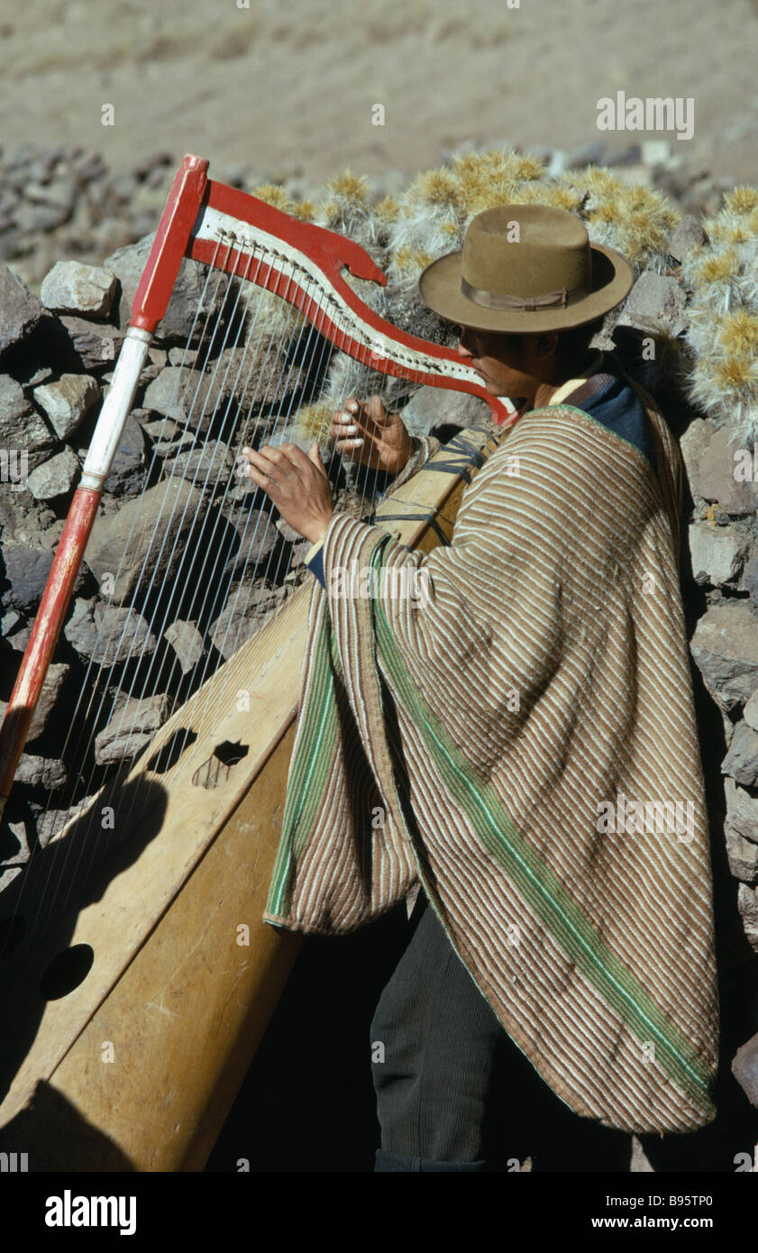 PERU South America Music Quechua Indian man playing traditional harp ...