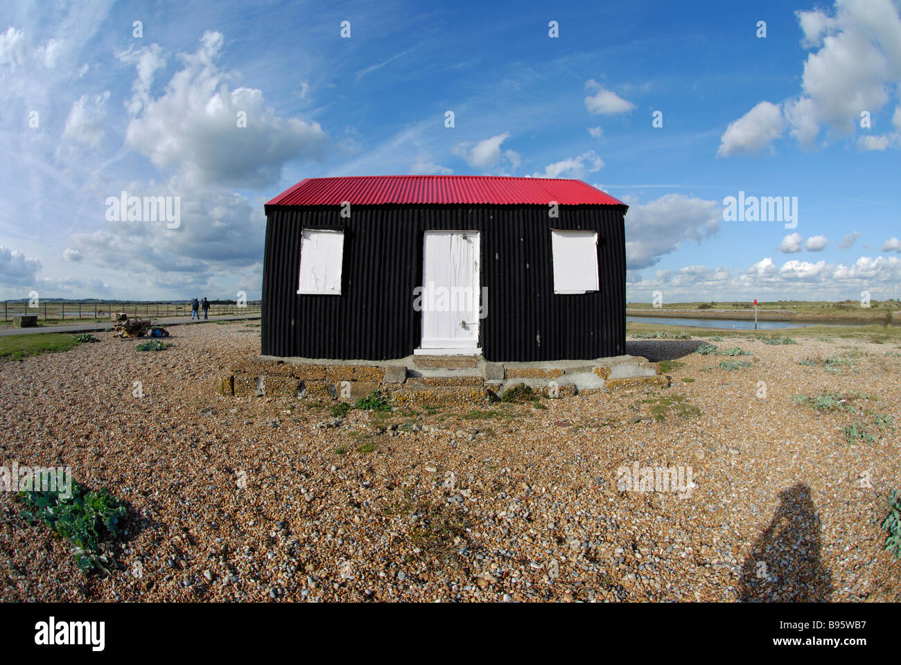 black & red hut on shingle in Rye Harbour E. Sussex Stock Photo - Alamy