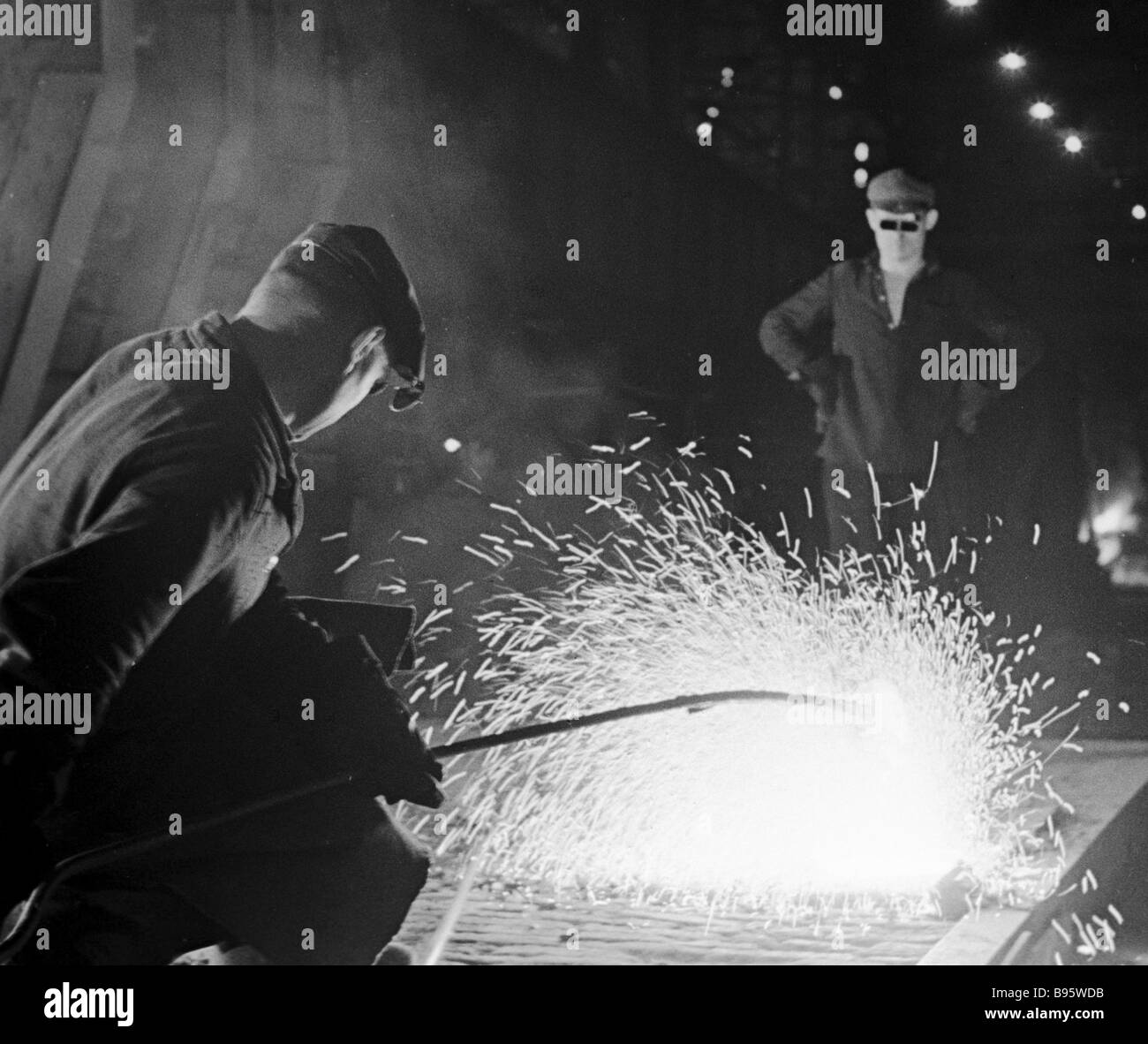 A steelmaker conducting steel smelting in a shop of the Krasnoye ...