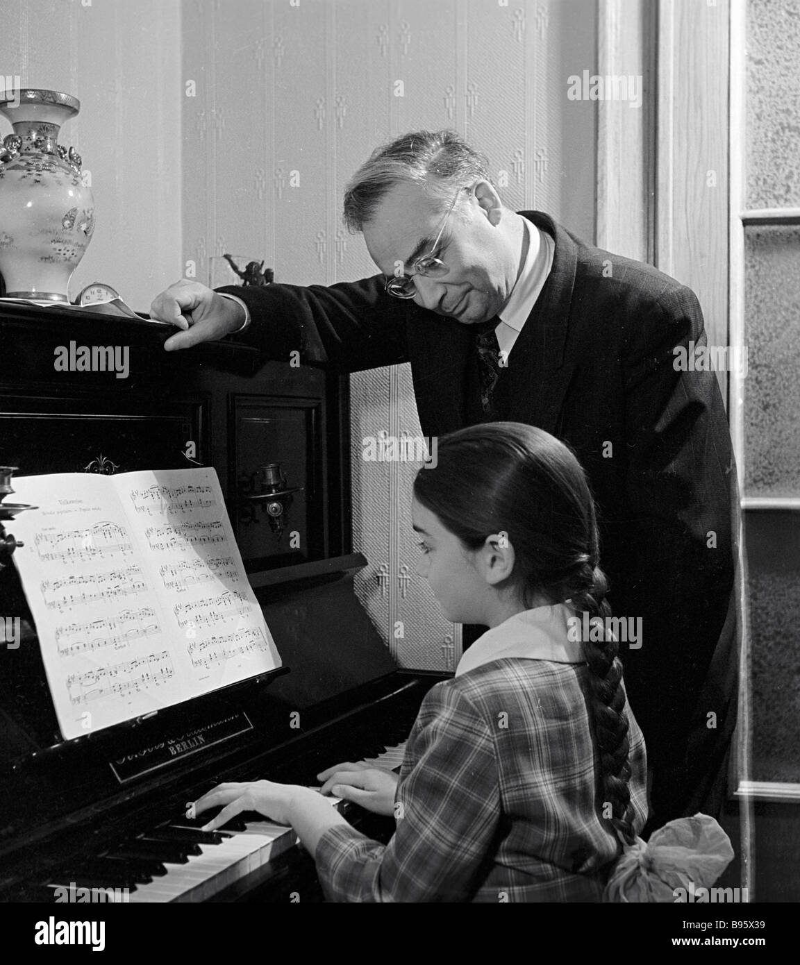 Leonid Sedov an Academy member watching his daughter play the piano ...