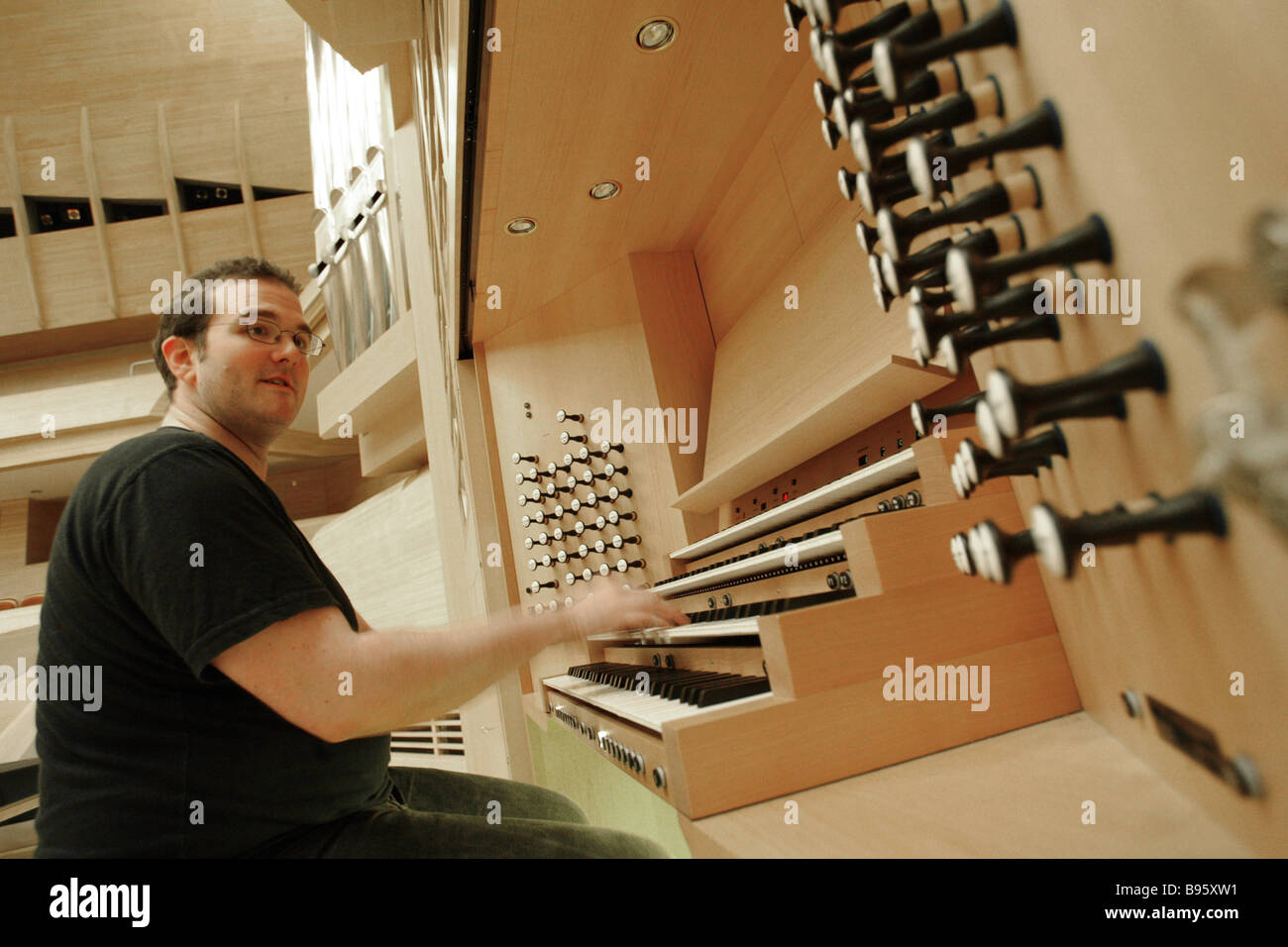 German musicians assembling and tuning a concert organ at the ...
