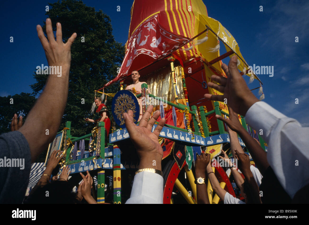England London Religion Hare Krishna hands of crowd reaching toward ...