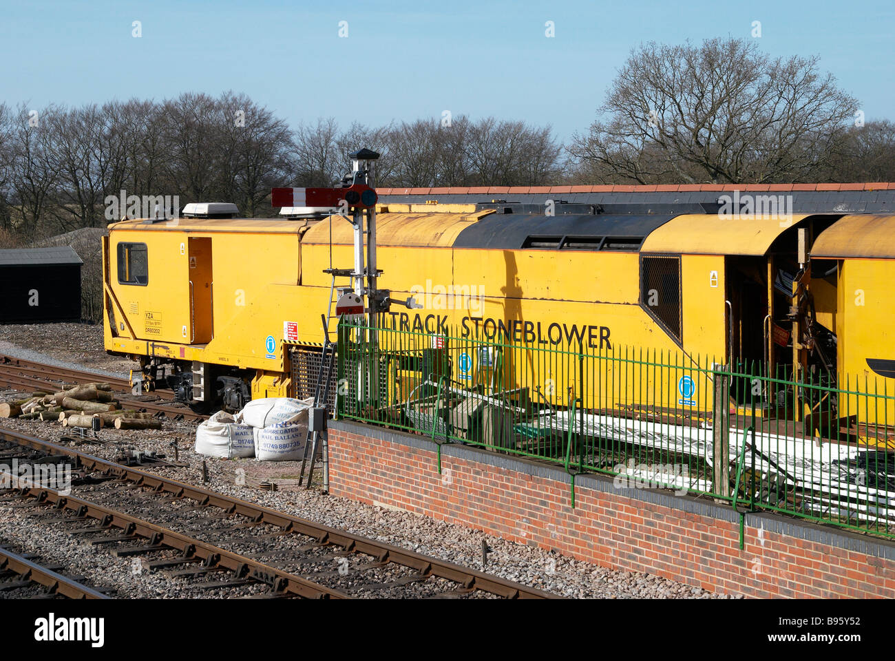 Railway maintenance stone blower and tamping machine Stock Photo - Alamy