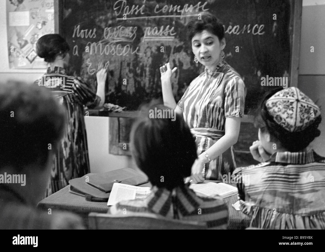 A French language teacher giving a lecture in Tajik University Stock ...