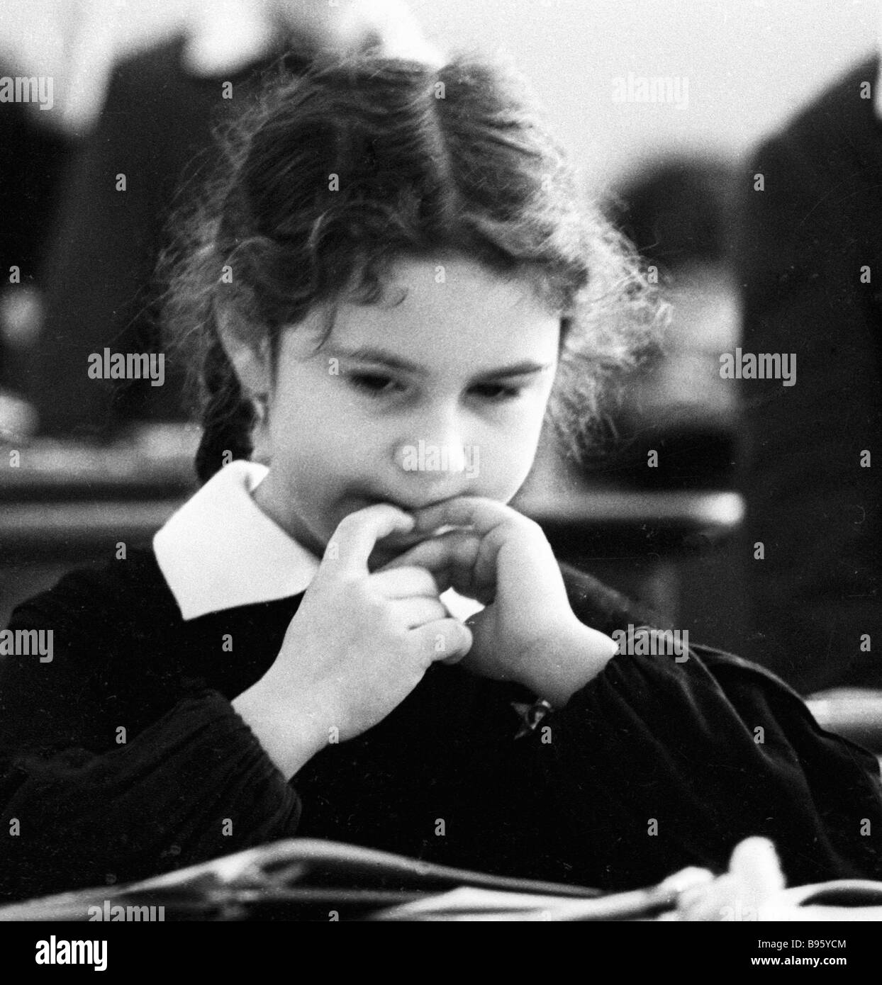 A first form schoolgirl at the desk Stock Photo - Alamy