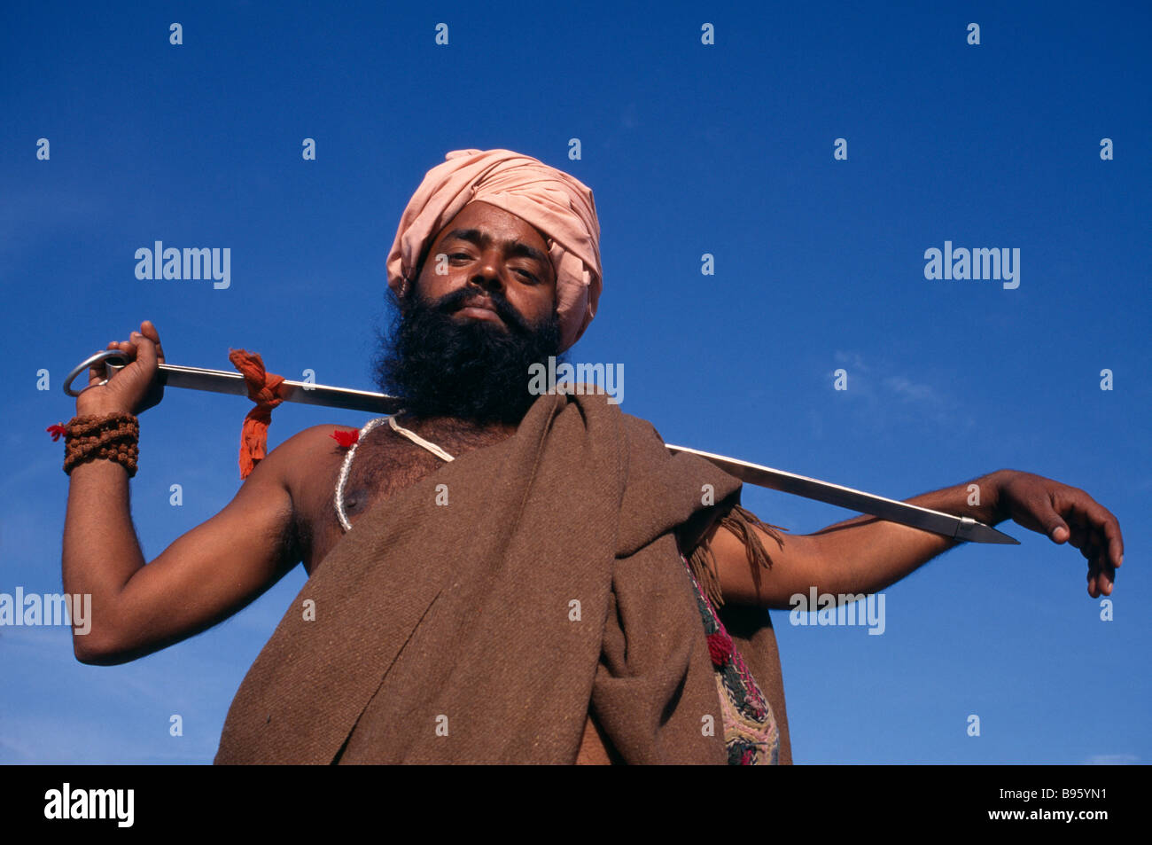 INDIA South Asia Delhi Sikh man holding Holy Kirpan Sword for the ...