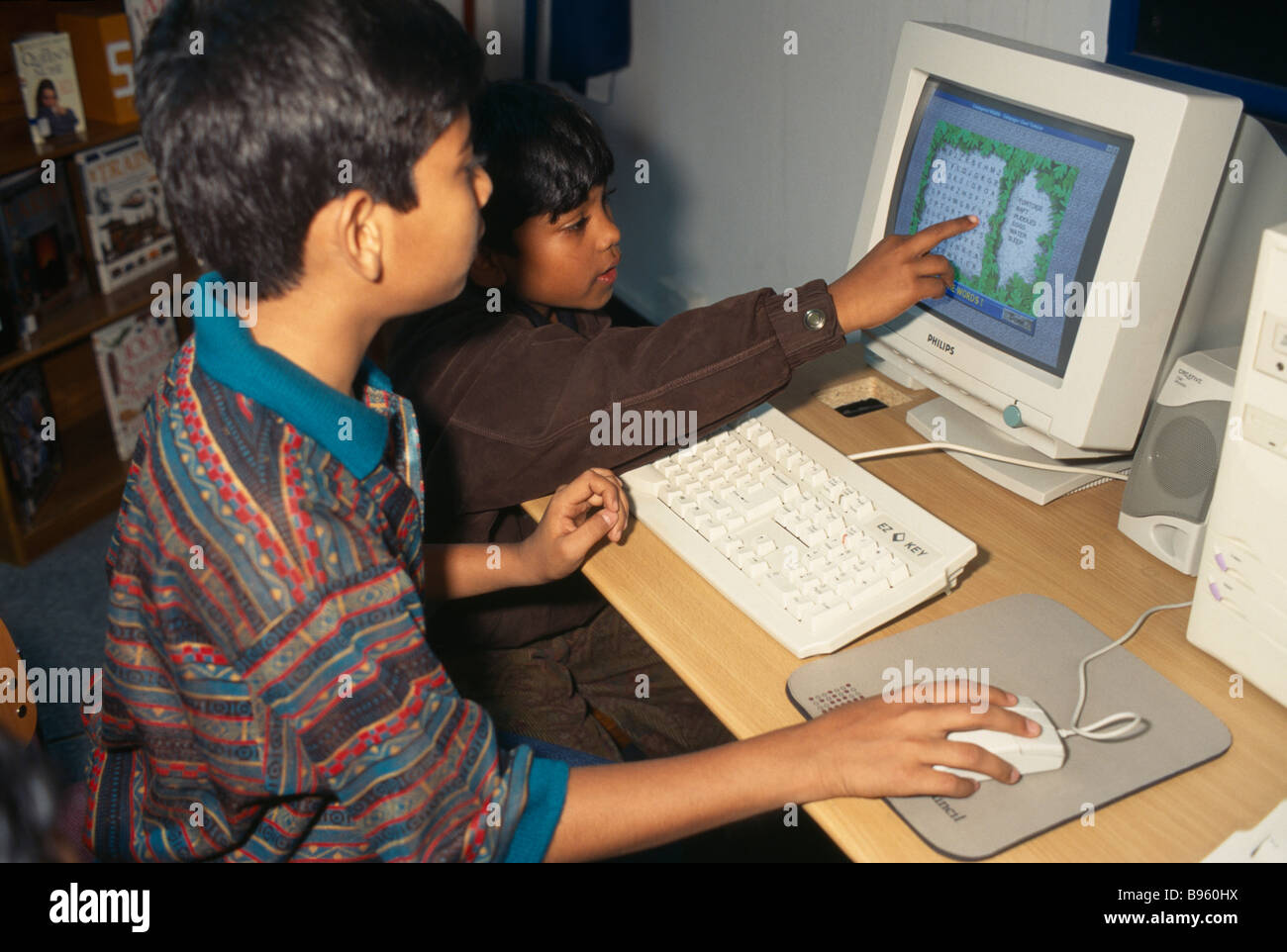 BANGLADESH Dhaka Two young boys learning English through computer games ...