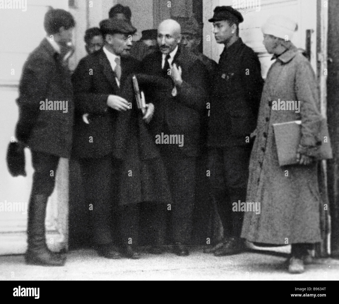 Vladimir Lenin second left and Nadezhda Krupskaya right with a group of ...