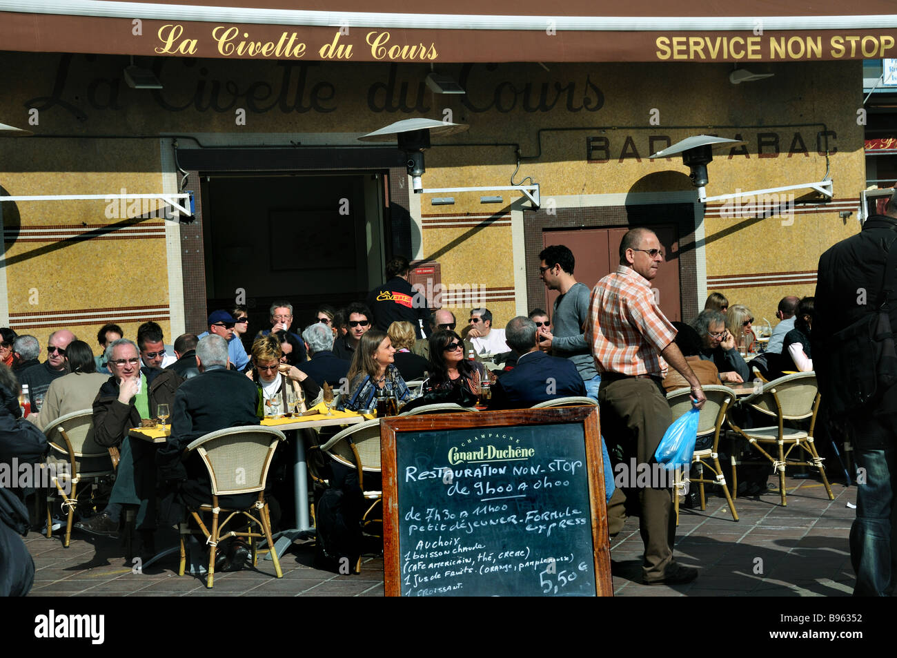 Friends meal outdoor cafe france menu blackboard chalkboard front bar ...