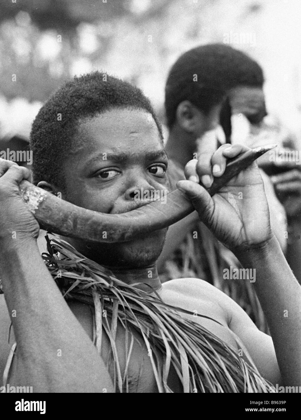 A Congolese villager plays a traditional folk instrument Stock Photo ...