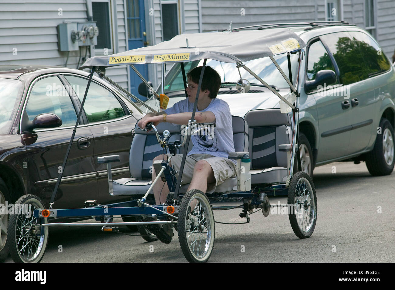 Alternative transportation, a pedal taxi waits for customers Stock ...