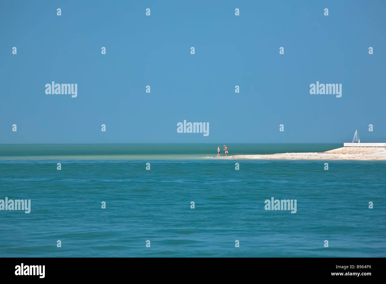 Couple on sand point in Fort Desoto State Park in St Petersburg Florida ...