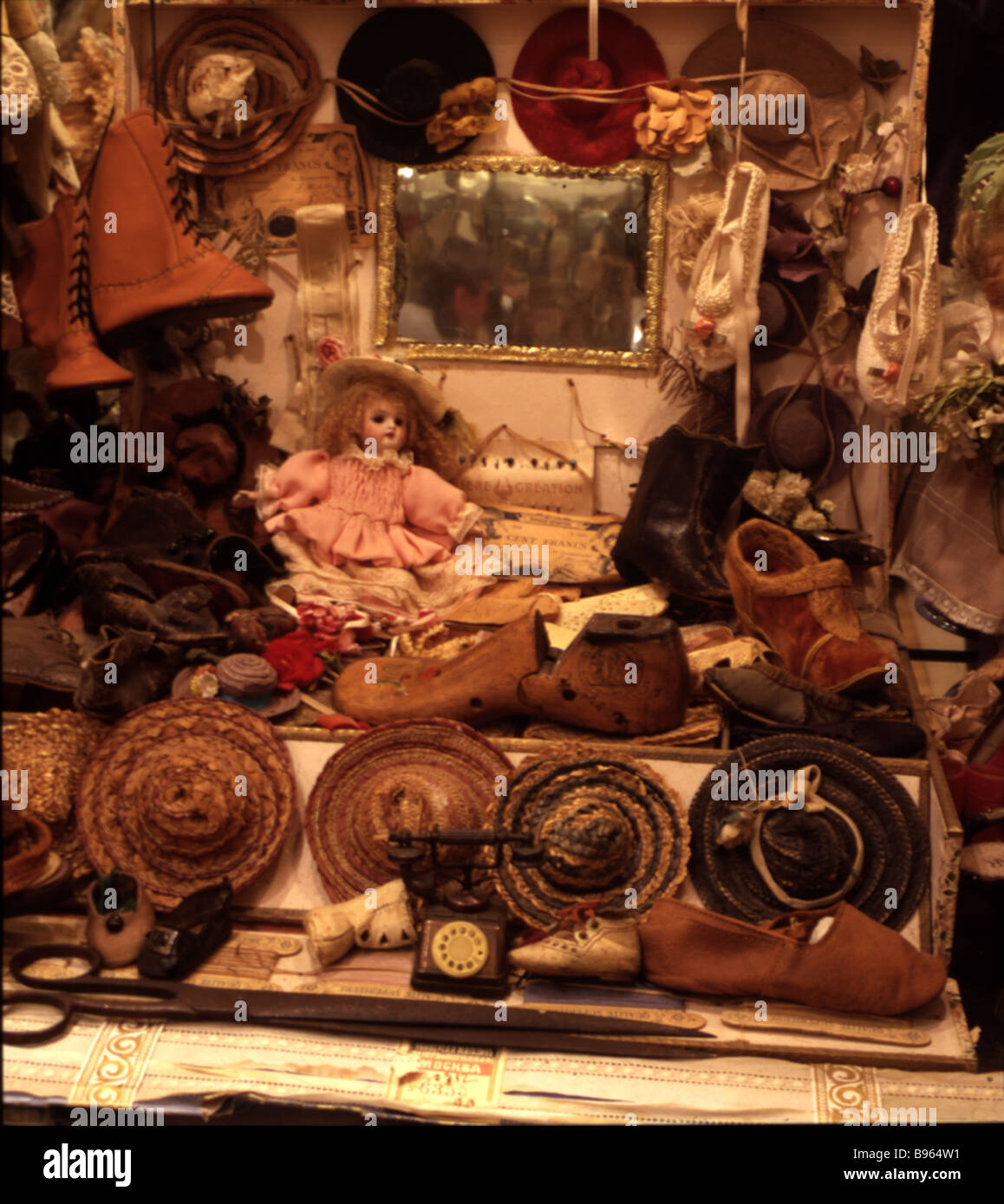 Improvised shop window displaying dolls accessories hats footgear etc ...