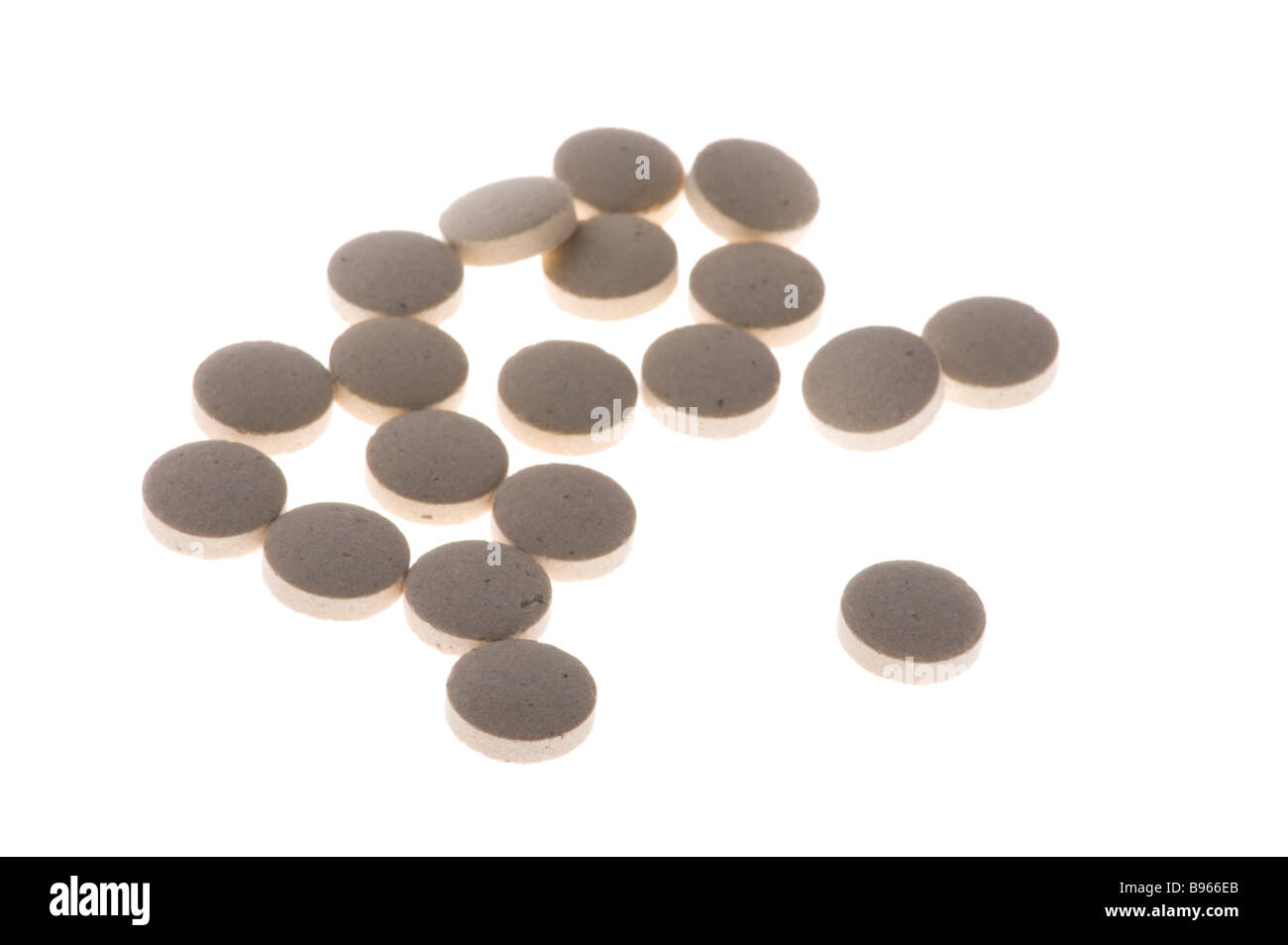 object on white tablet close up Stock Photo - Alamy