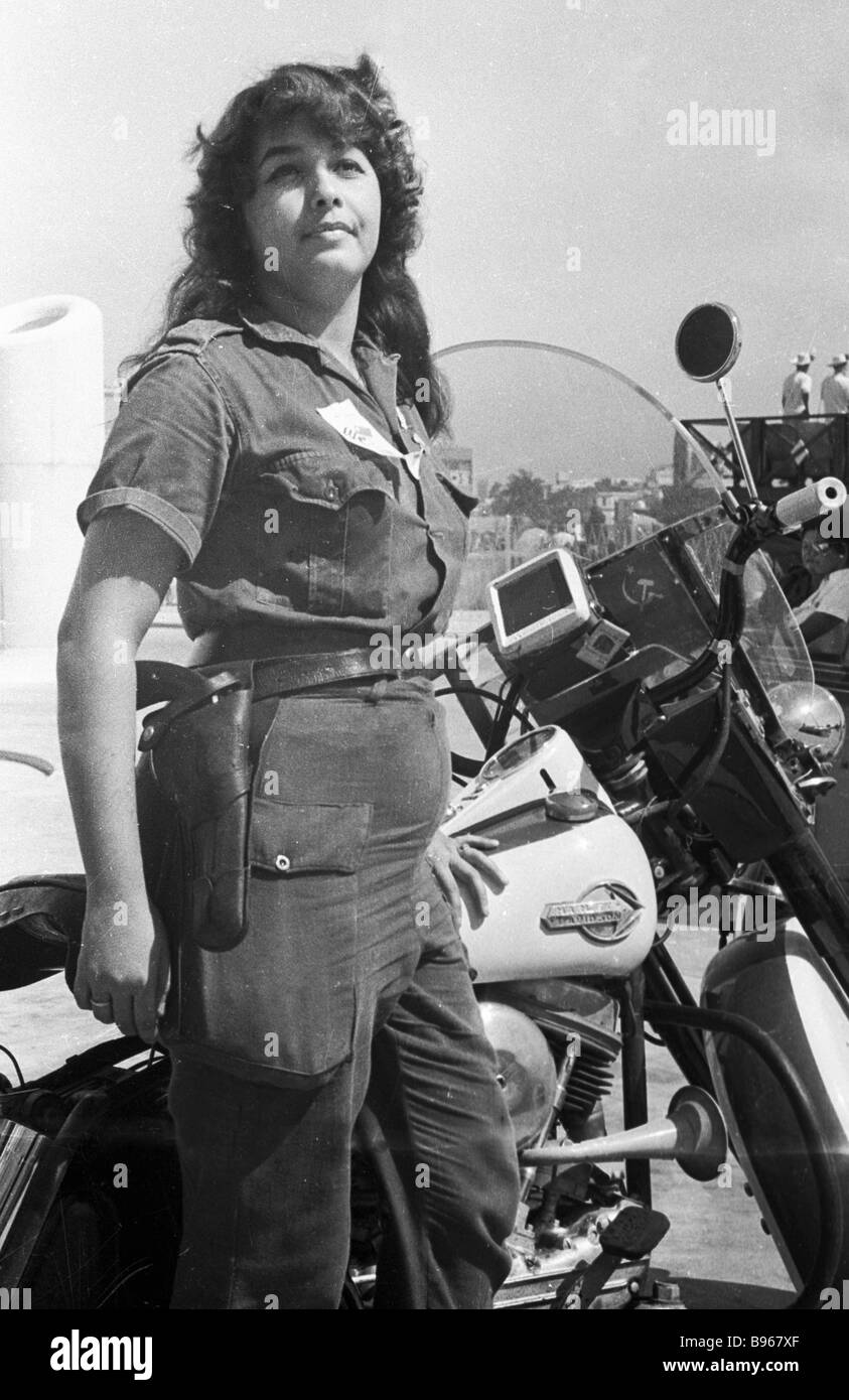 A female police officer near the motorcycle Havana Stock Photo - Alamy