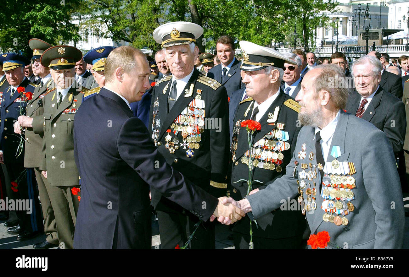 President Vladimir Putin welcoming WW II veterans at the Tomb of the ...