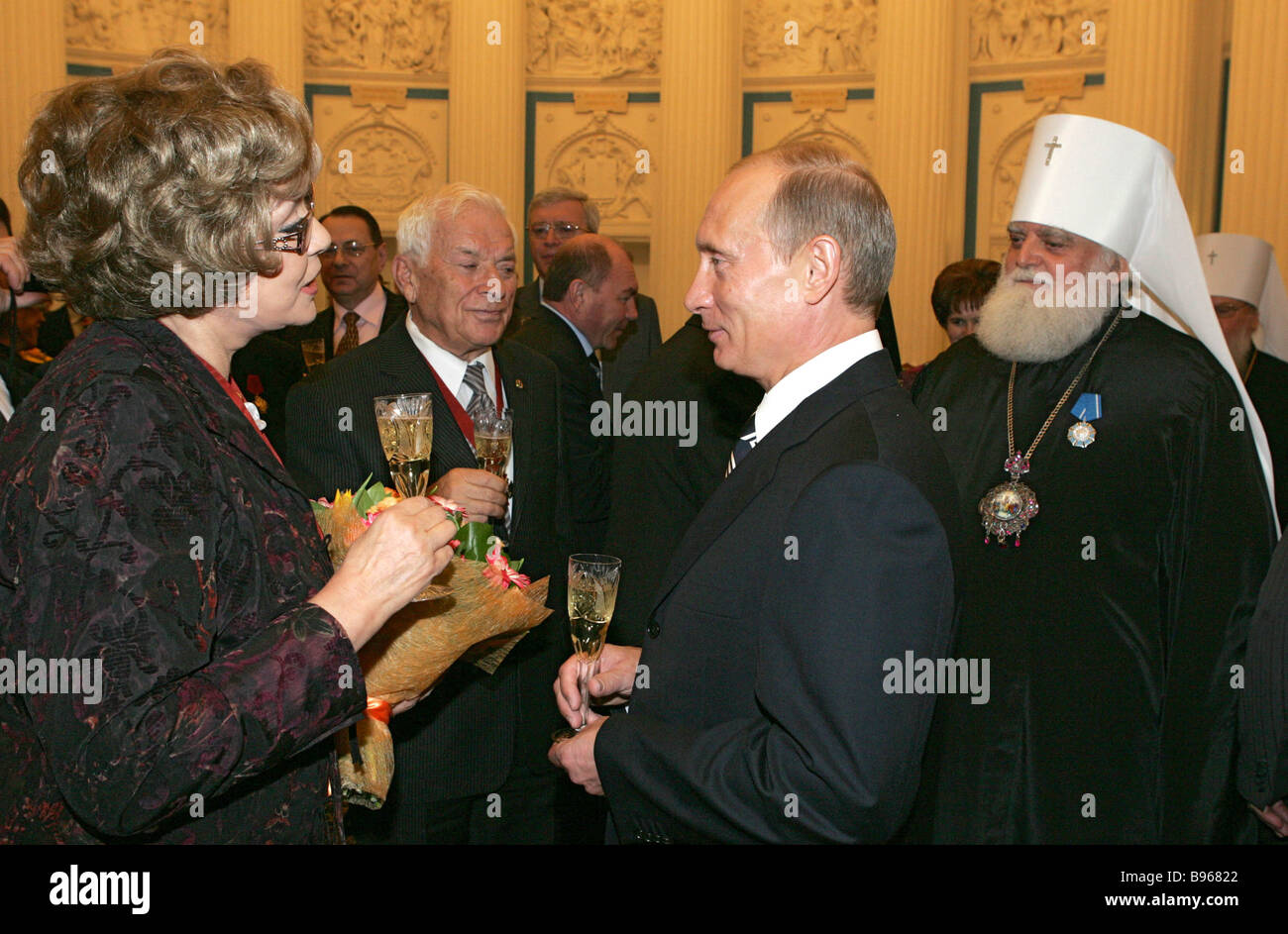 Russian President Vladimir Putin center and singer Edita Pieha after a ...