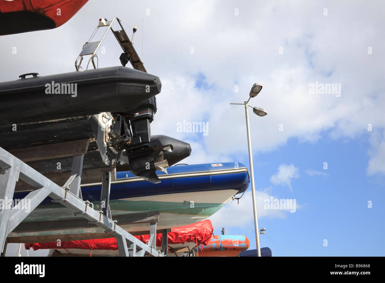 RIBs in a Rack in Portsmouth showing the outboard motors Stock Photo ...