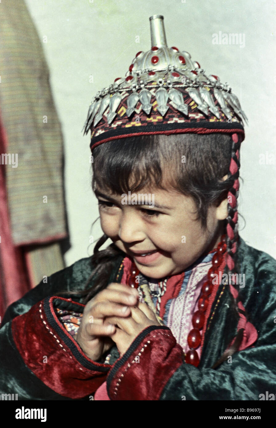 A girl in a national dress at the Pakhta Bairam harvest festival Stock ...