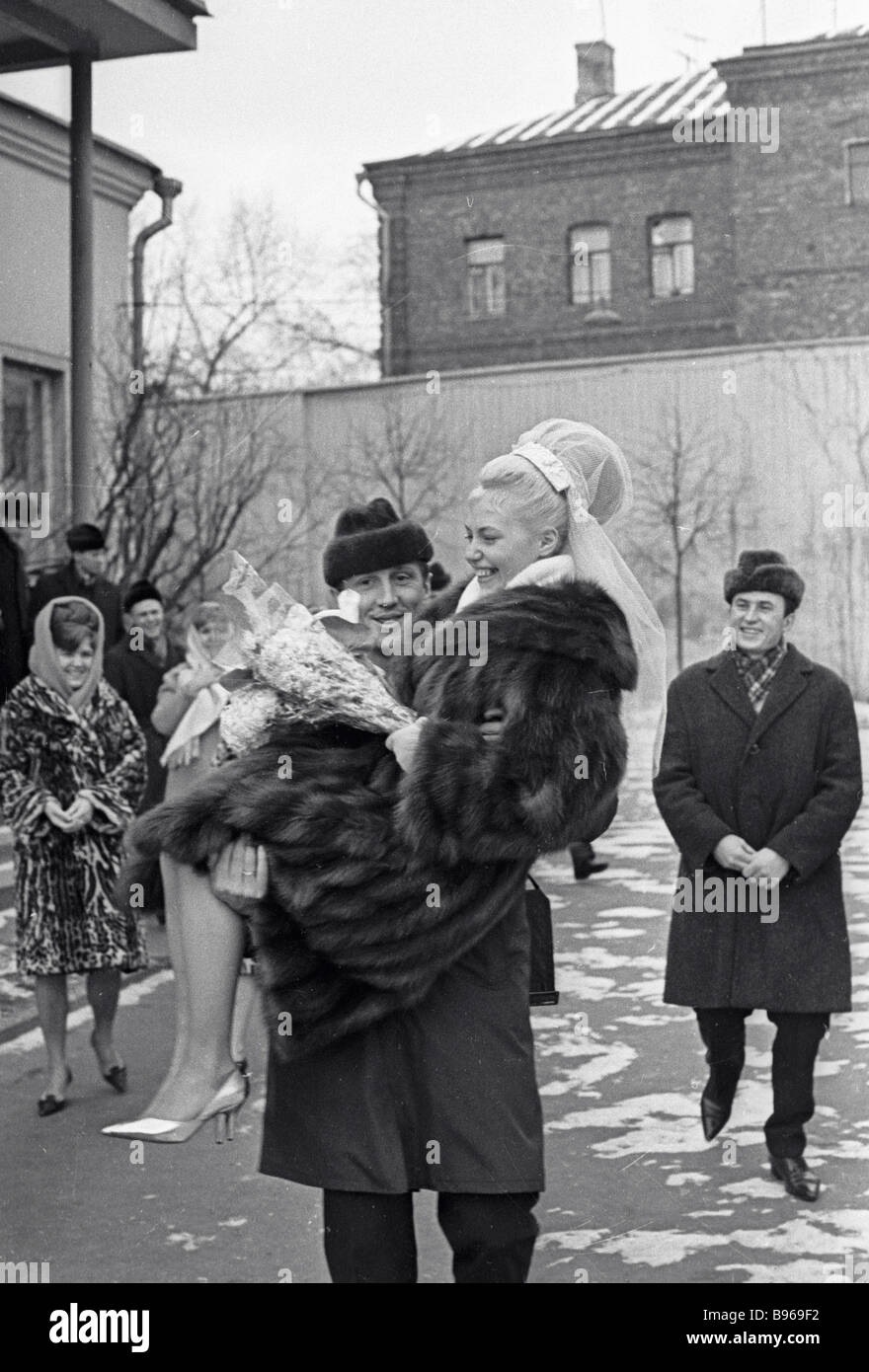 National soccer team back Abert Sherstnyov carrying in his arms his ...