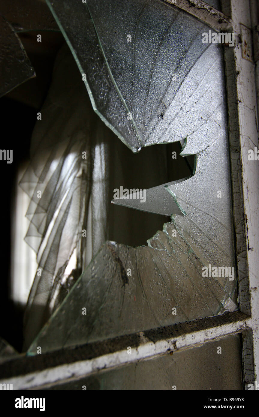 A broken window lets in stormy weather and rain in this foreclosed home ...