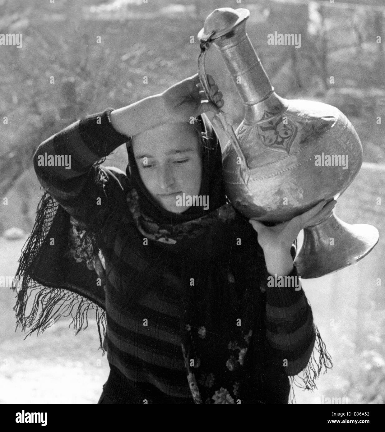 An Avar girl carrying a jug Stock Photo - Alamy