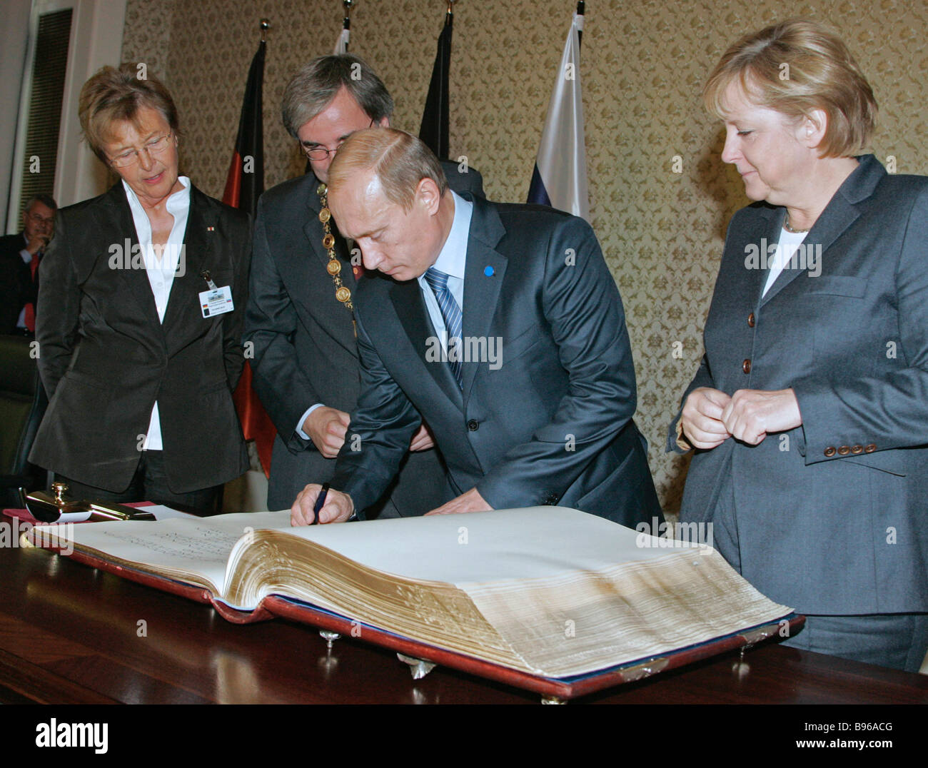 Russian President Vladimir Putin signing the book of distinguished ...