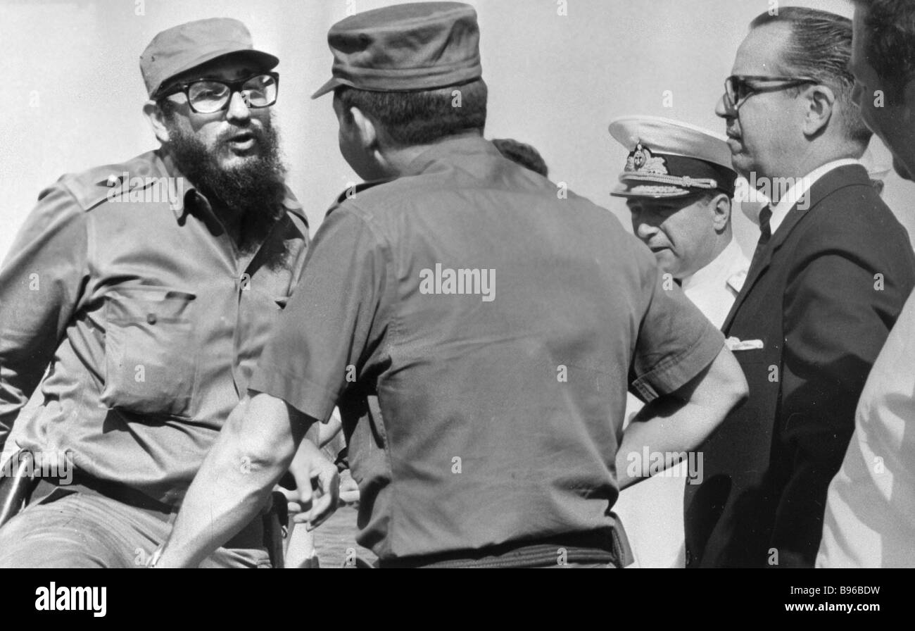 Cuban Prime Minister Fidel Castro left talking to Soviet naval sailors ...