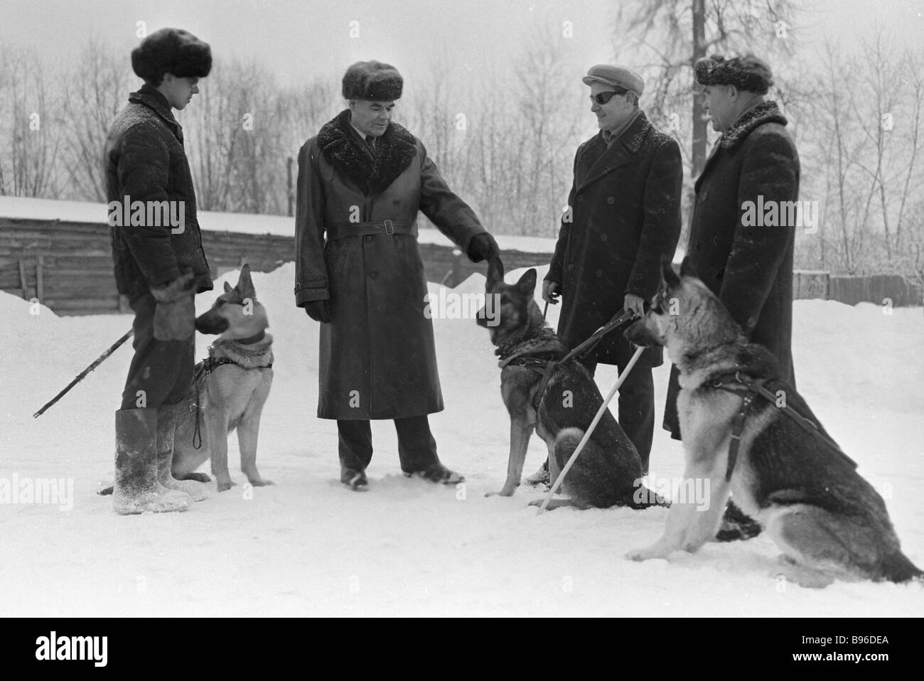 A guide dog school instructor introduces the blind men and their future ...