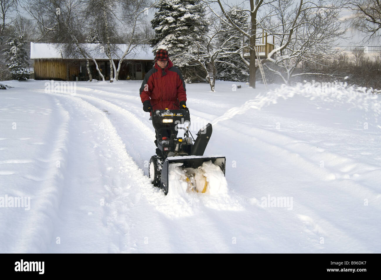 Man using snowblower to clear driveway, Hudson Valley, New York Stock ...