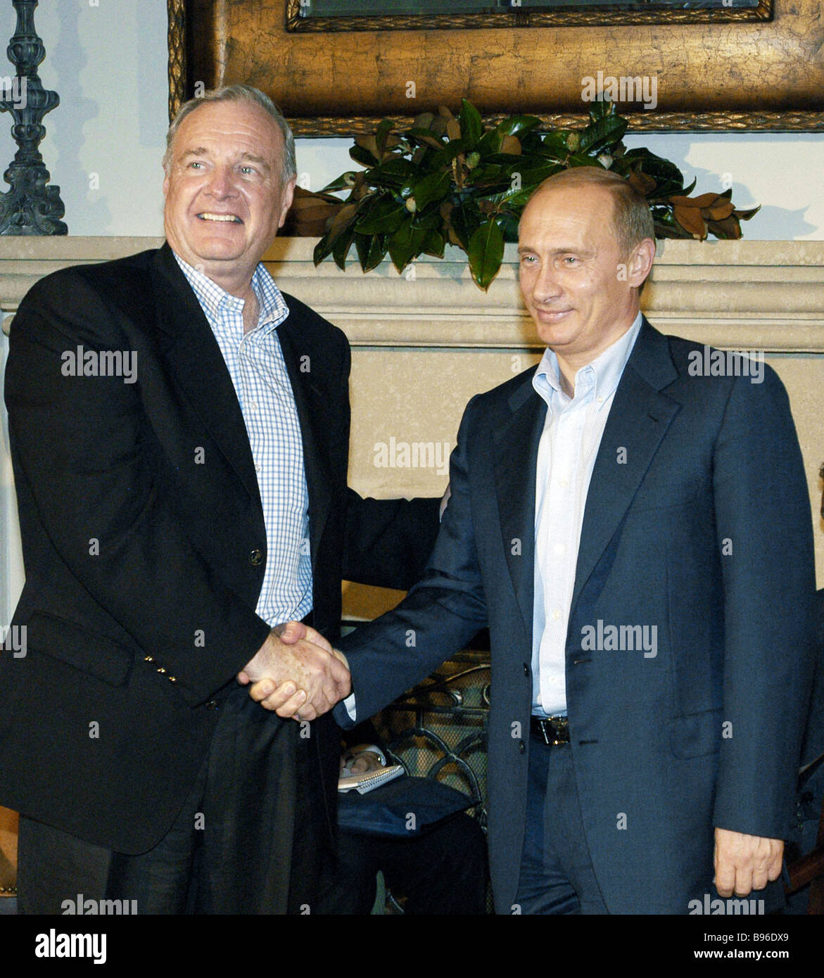 Russian President Vladimir Putin right and Canadian Prime Minister Paul ...