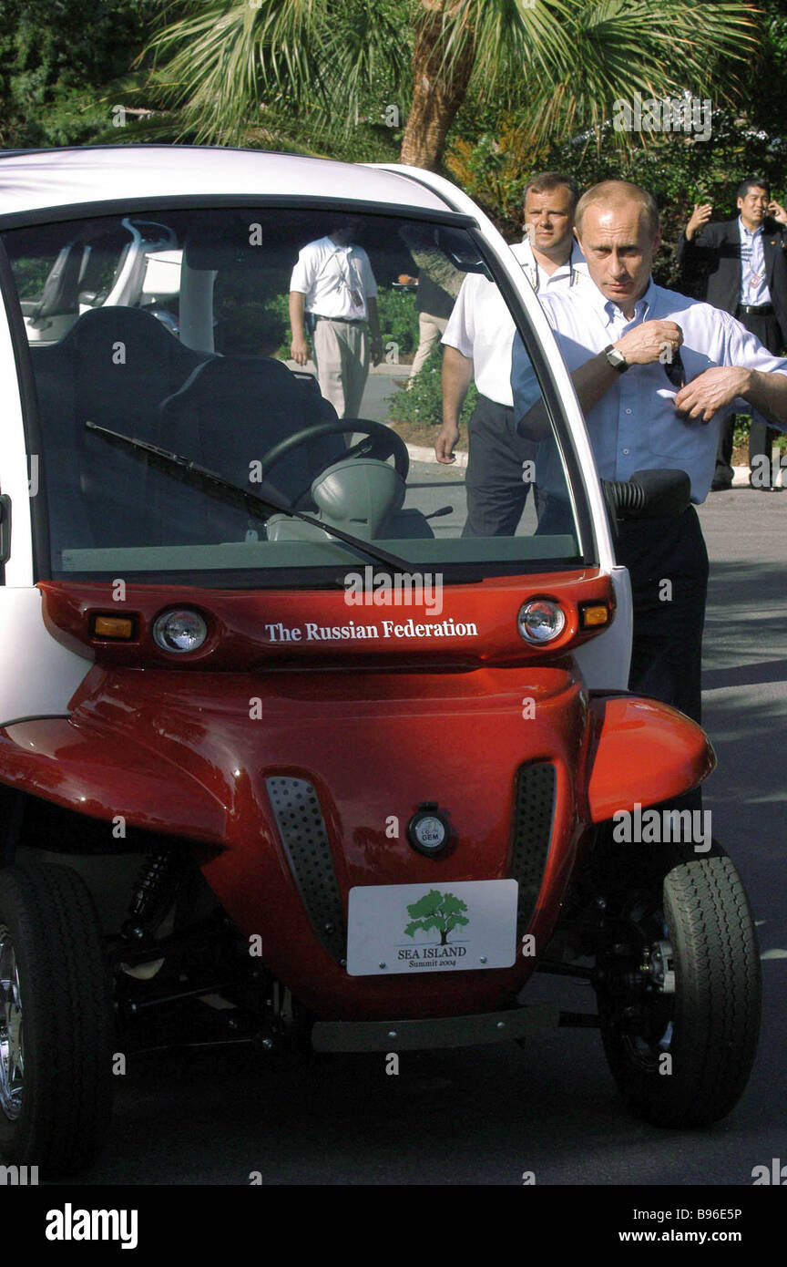 Russian President Vladimir Putin driving in an electromobile to his ...