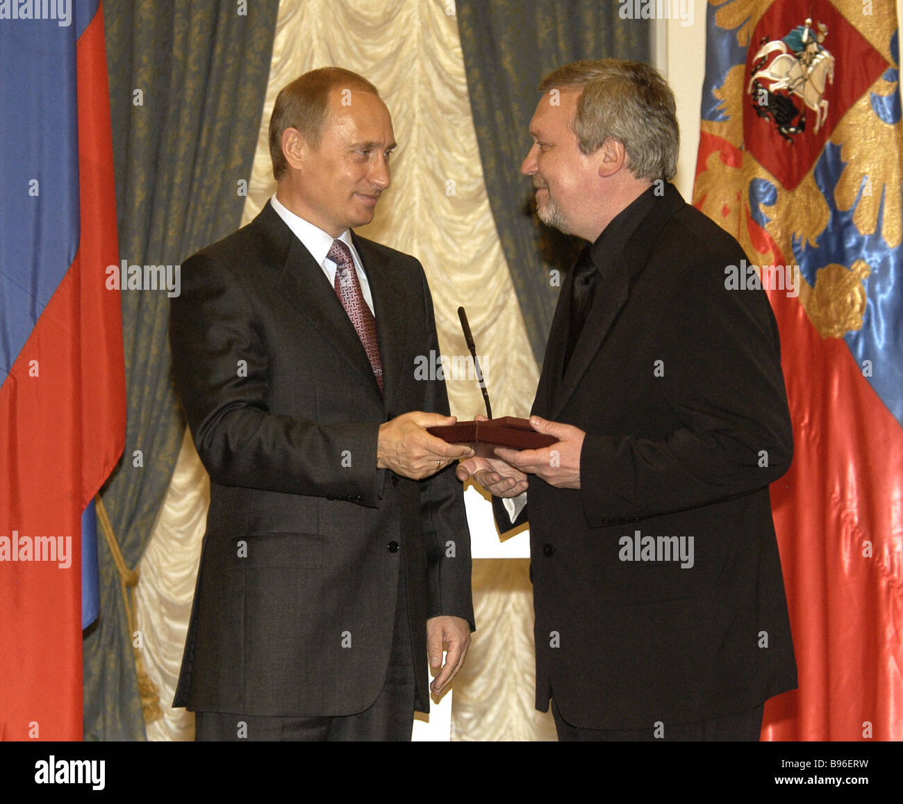 Russian President Vladimir Putin left conferring the 2003 Literature ...