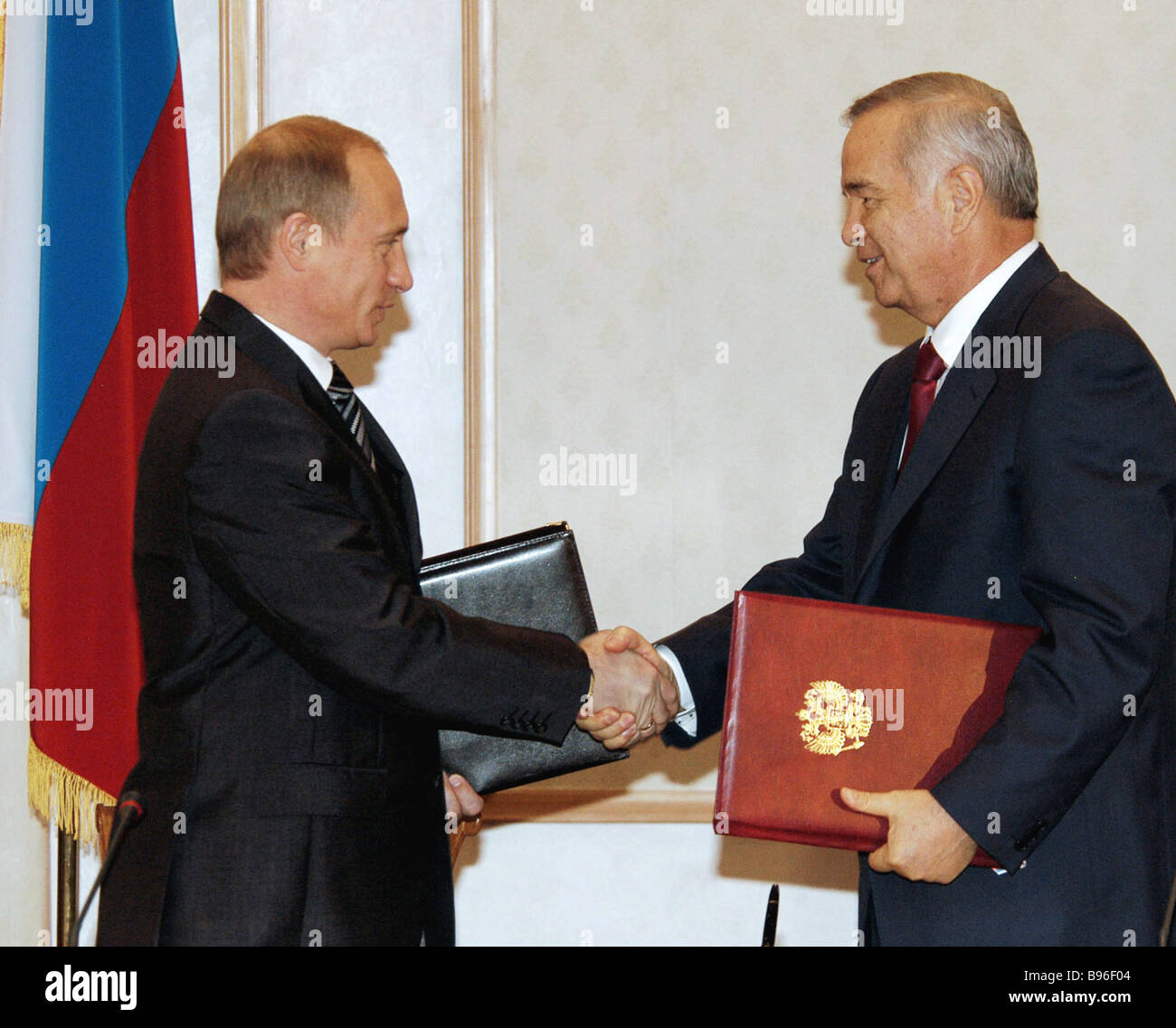 Russian President Vladimir Putin Left And President Of Uzbekistan Islam