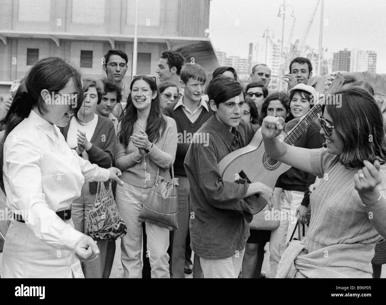 Students dance to the guitar in Malaga Stock Photo - Alamy