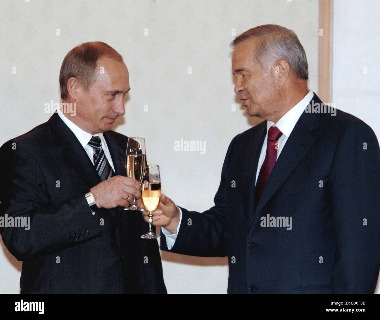 Russian President Vladimir Putin Left And President Of Uzbekistan Islam