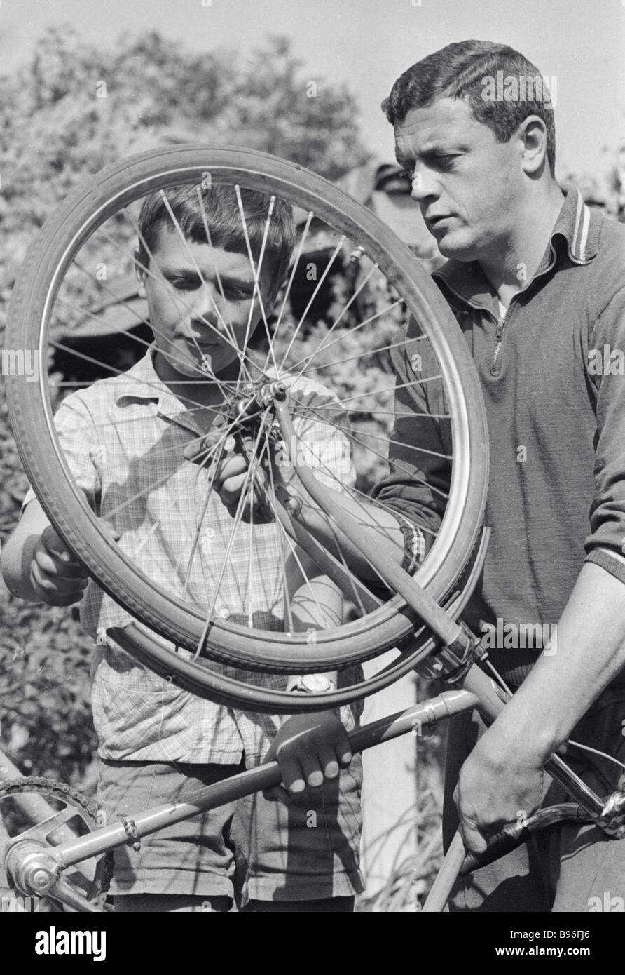 Cosmonaut Vladislav Volkov right with son Volodya left repairing a ...