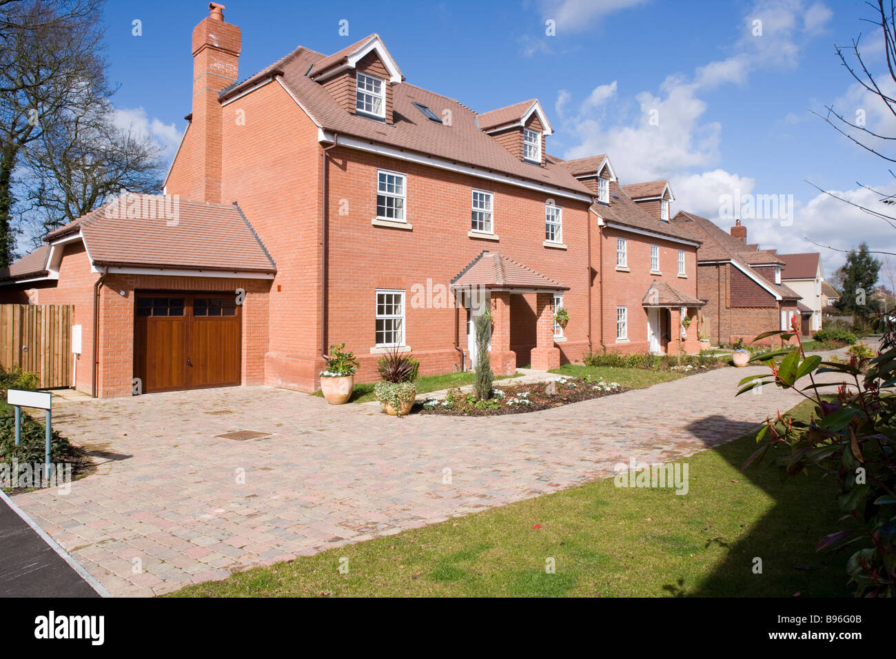 Detached houses with garage Stock Photo - Alamy