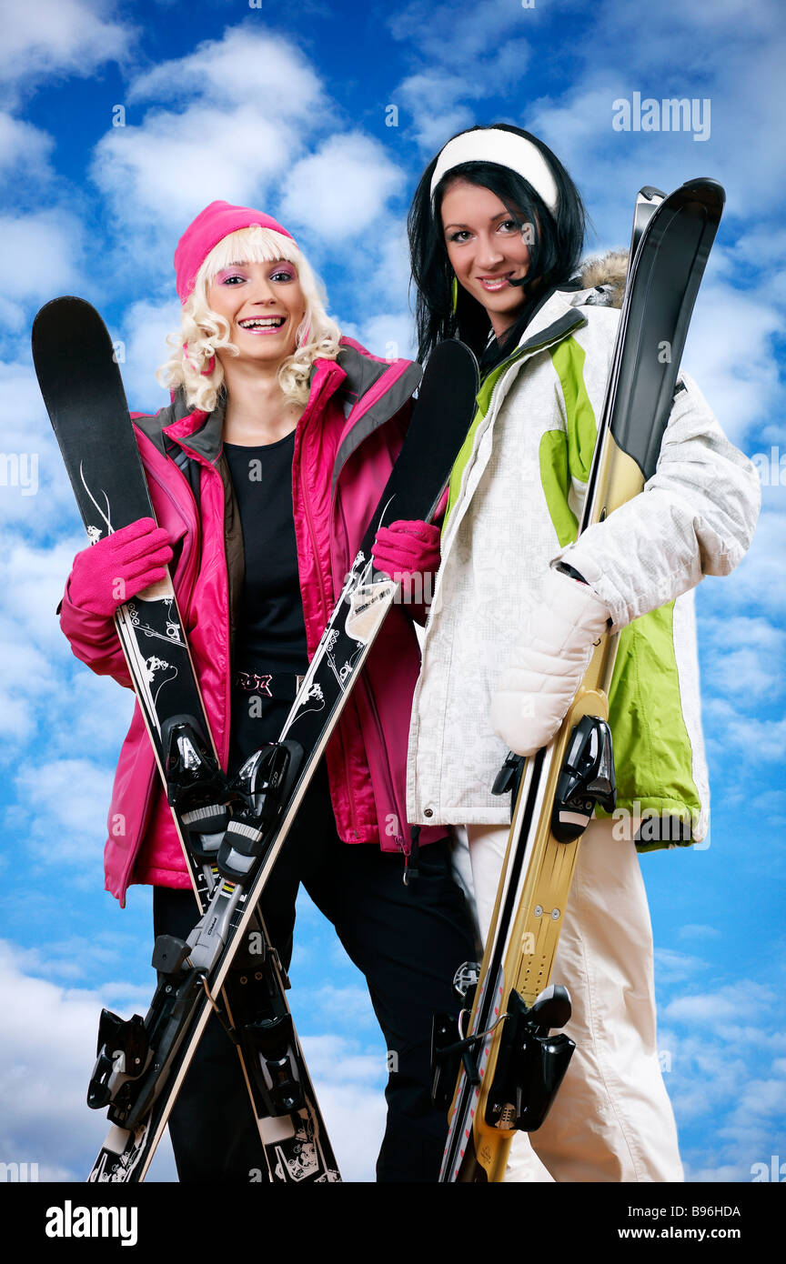 Two Skiers hold Ski Stock Photo - Alamy
