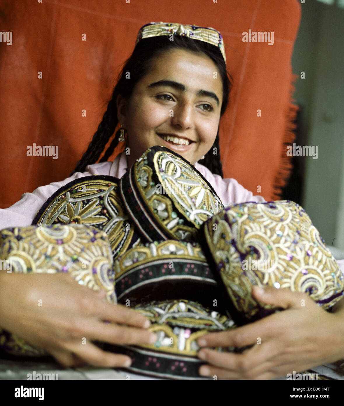 A Tadjik girl with skull caps Stock Photo - Alamy