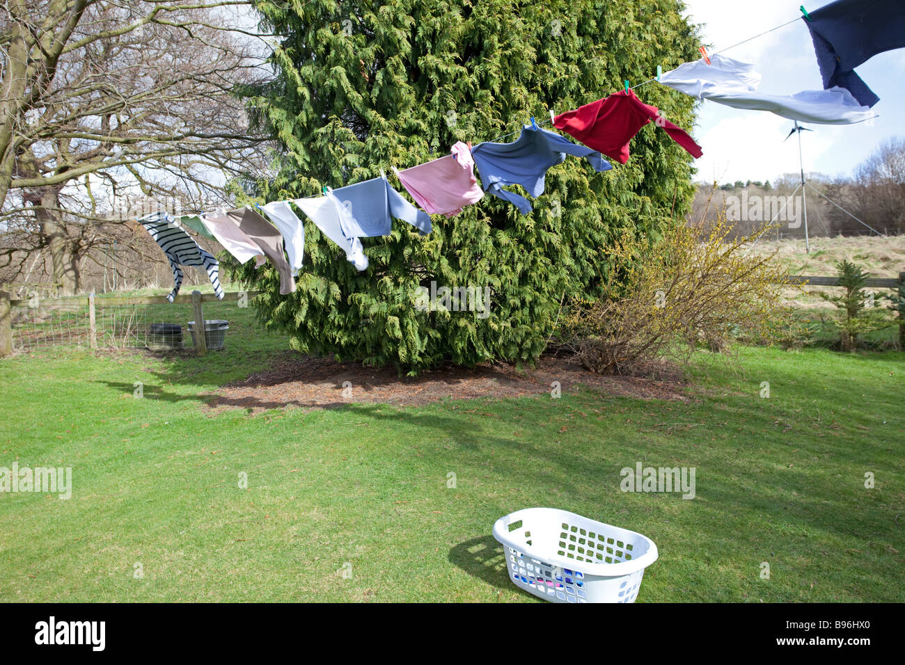Washing line with clothes drying in the wind Cotswolds UK Stock Photo ...