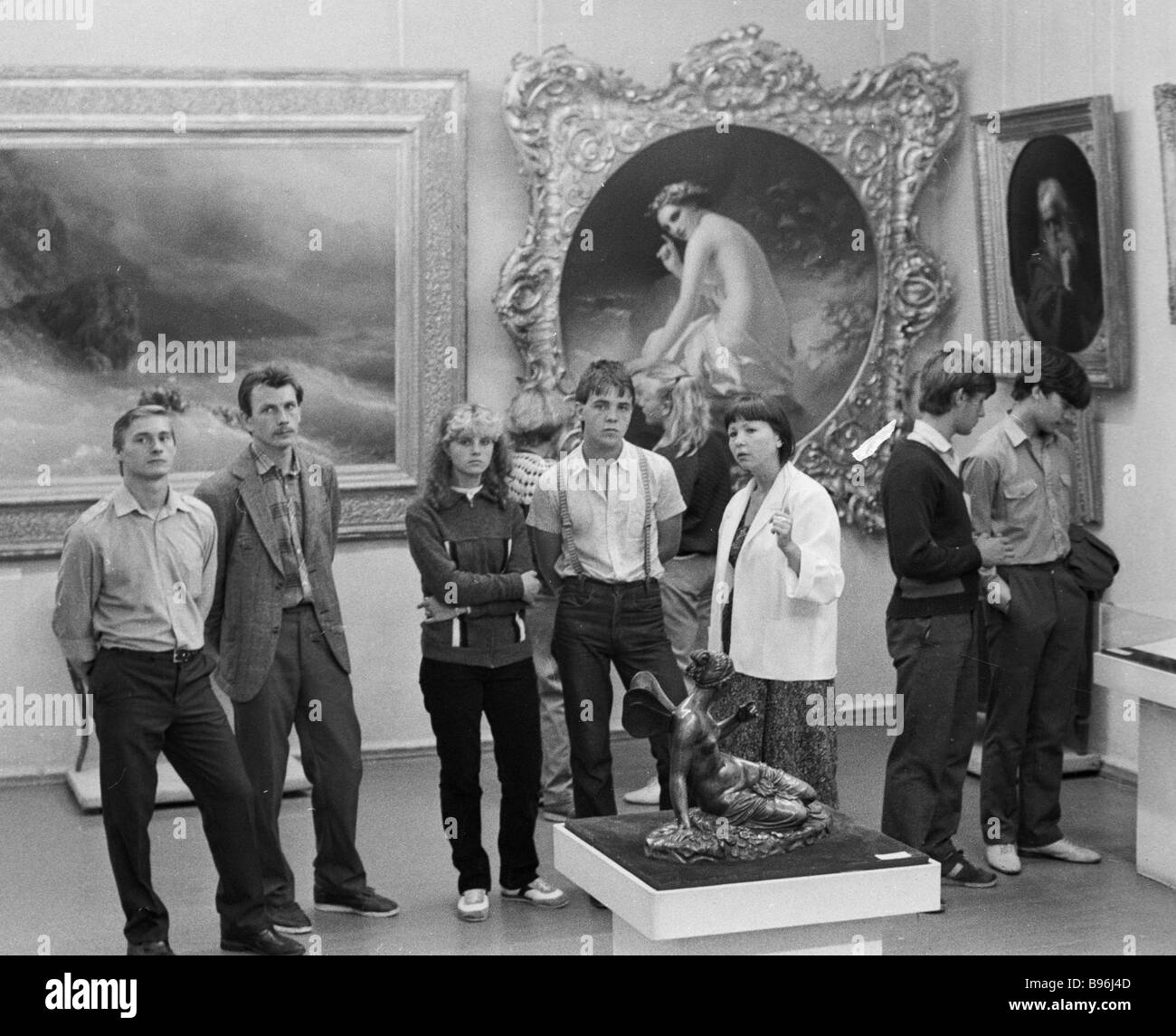 Visitors admire paintings at Russian Art Hall of Omsk Fine Arts Museum ...