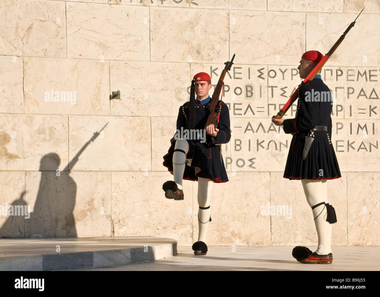 Evzones changing the guard at the tomb of the unknown soldier in Syndagma Square in the center ...