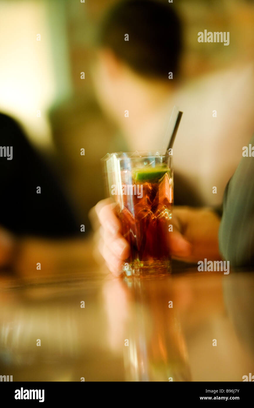 Hand holding a drink Stock Photo - Alamy