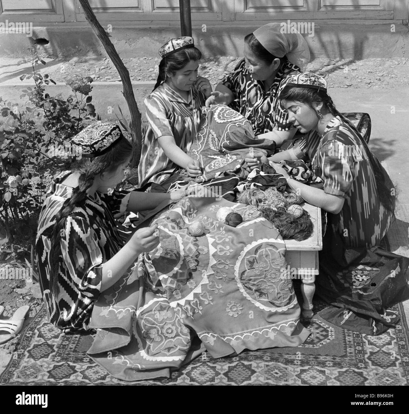 Embroidering festal dresses Stock Photo - Alamy