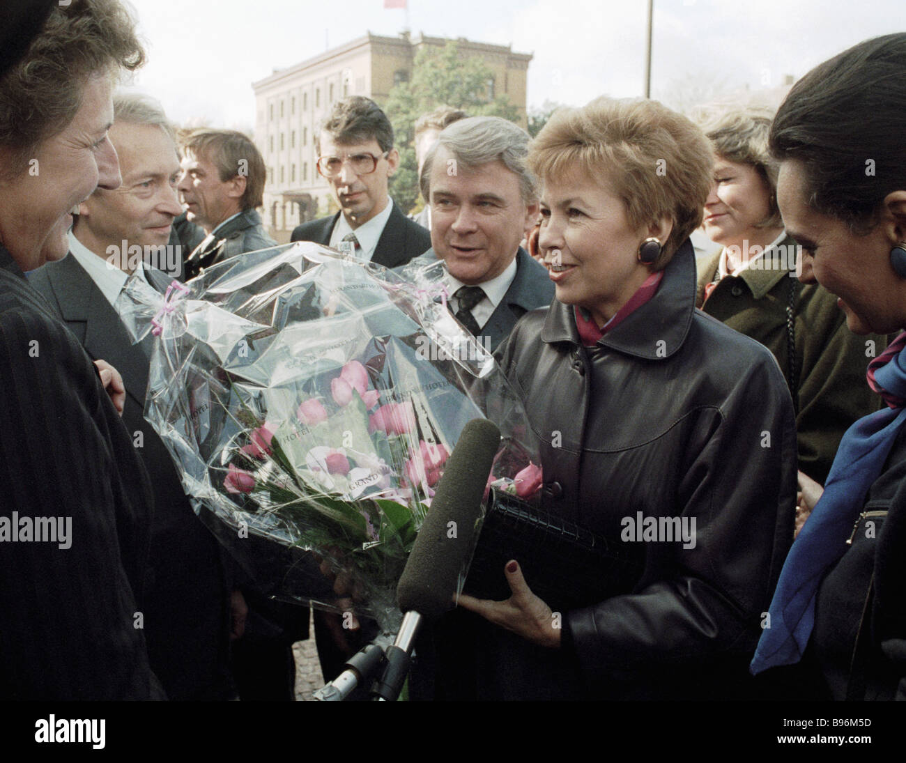Raisa Gorbachev second from right talking to Berliners during a visit ...