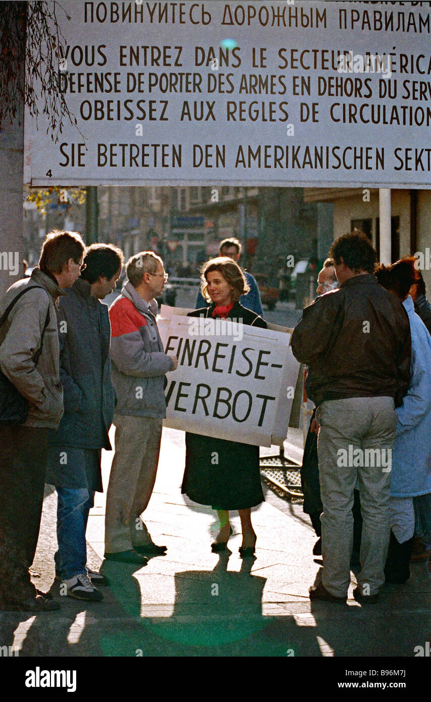 German Democratic Republic residents standing at the Checkpoint Charlie ...