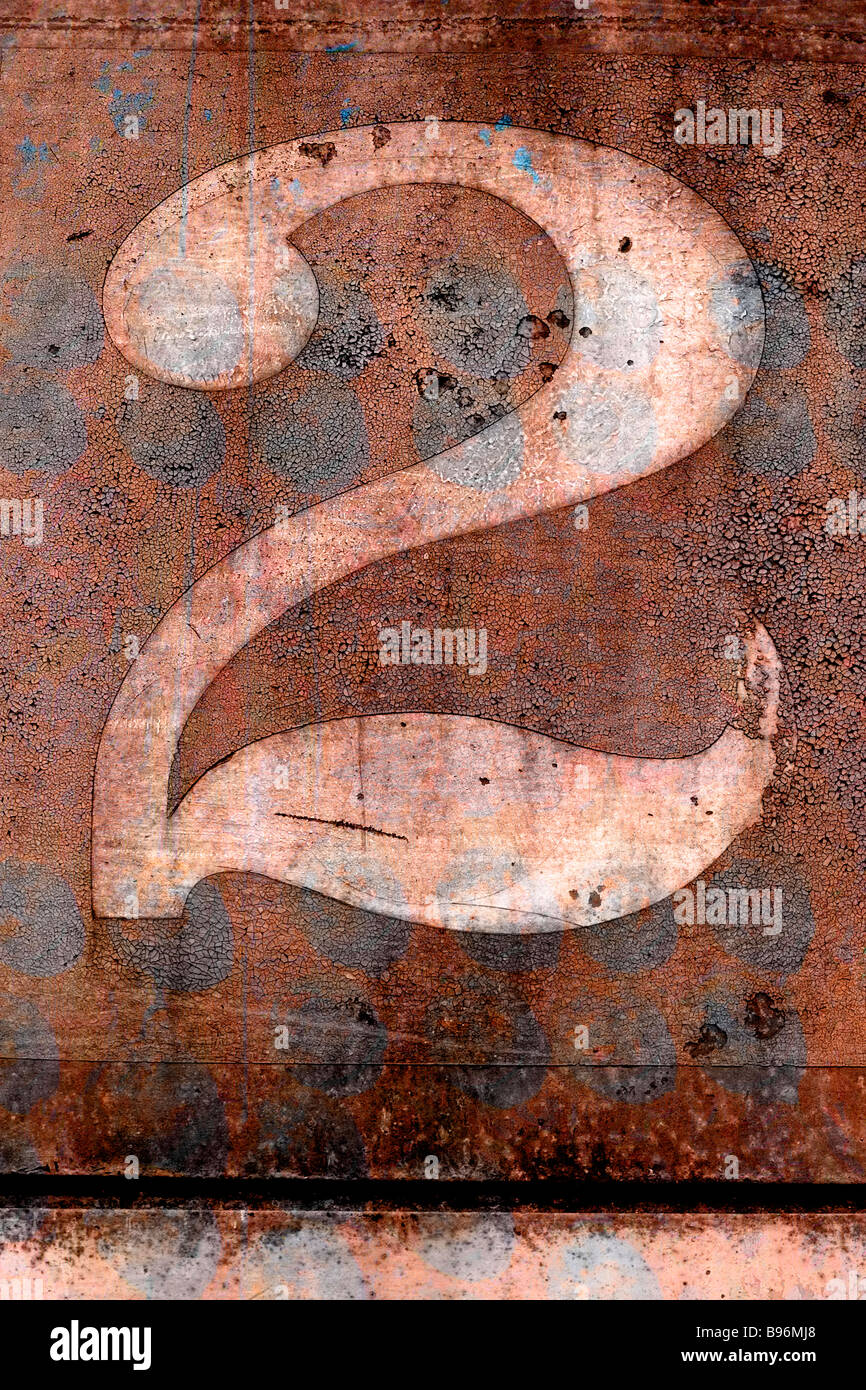Number two 2 on textured background with brown and blue and peach ...