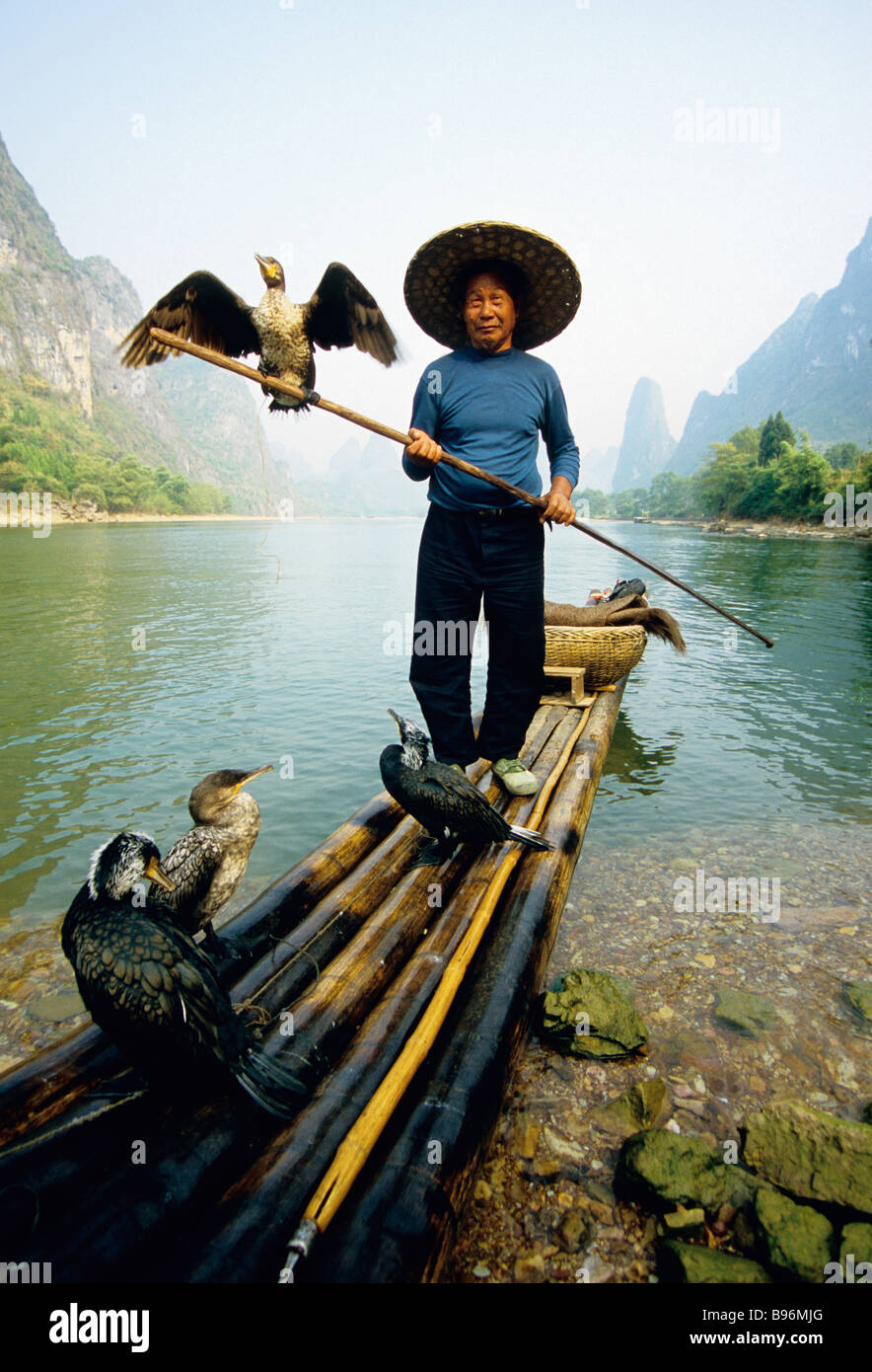 Li River cormorant fisherman on bamboo raft near Xingping (Guilin area ...